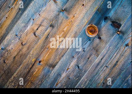 Colorful structure of old shabby wall painted with blue, yellow and ...