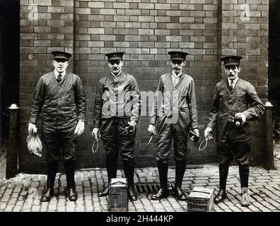 Liverpool Port Sanitary Authority rat catchers dressed in protective ...