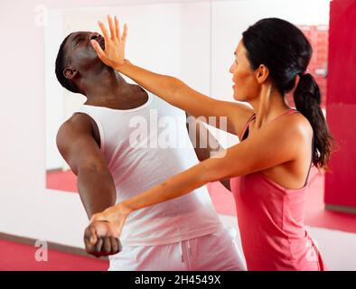 Asian woman training captures on self-defense course Stock Photo - Alamy