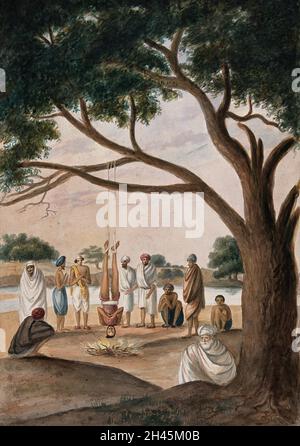 A Hindu ascetic or holy man: suspended by a hook and two spikes ...