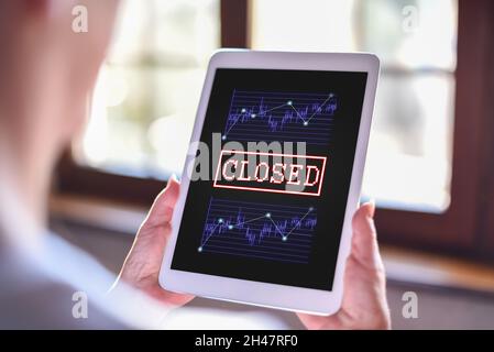 Tablet screen displaying a closed stock market concept Stock Photo - Alamy