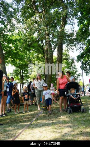 POZNAN, POLAND - Jan 27, 2018: Woman and young boy steering something ...