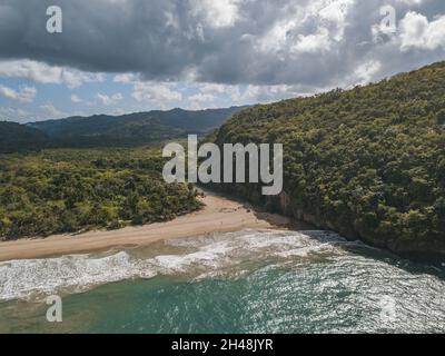 Landscape of El Valle Beach surrounded by greenery and sea in Samana ...