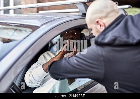 Robber thief criminal using gun extortion witness. outlaw concept Stock ...