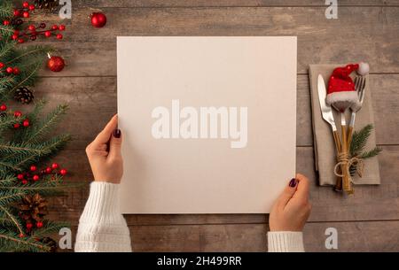 Happy woman holds fork and spoon indoors Stock Photo - Alamy