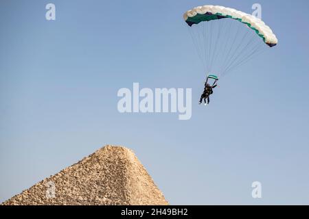 Giza, Egypt. 01st Nov, 2021. Professional skydivers fly over the Great ...