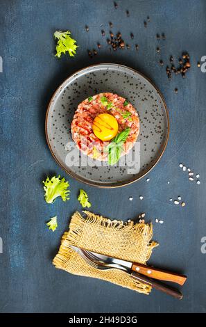 tar-tar from beef with raw yolk on plate Stock Photo - Alamy