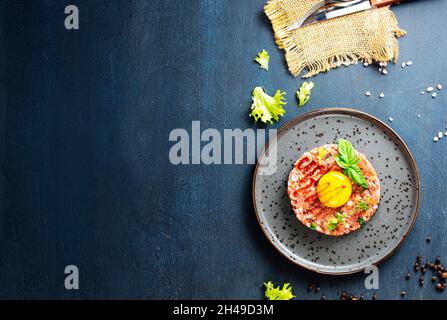 tar-tar from beef with raw yolk on plate Stock Photo - Alamy