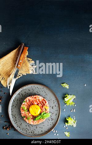 tar-tar from beef with raw yolk on plate Stock Photo - Alamy