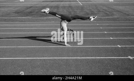 There is always a new trick to learn. Girl do handstand with legs in ...