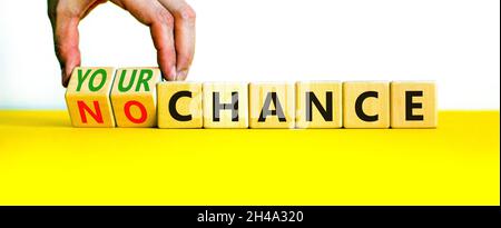Your or no chance symbol. Businessman turns wooden cubes and changes ...