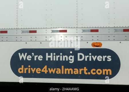 The Walmart truck fleet has WeÕre Hiring Drivers signage on the back of ...