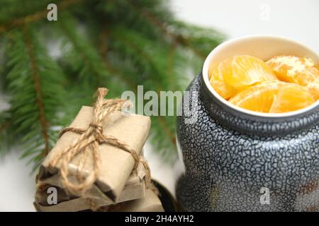 Close-up mug of lobule orange mandarin or tangerine on green natural ...