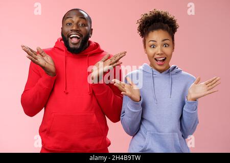 Impressed happy thrilled young pair african man woman relationship ...