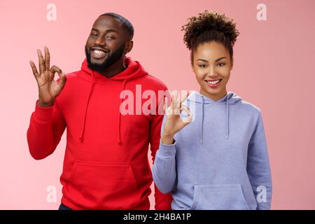 Two african-american skilful coworkers professionals assured friend ...