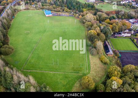 Aerial view of a fully marked Rugby Union pitch surrounded by trees in ...