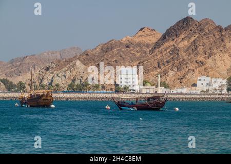 Traditional dhow boats near Mutrah Corniche in Muscat, Oman Stock Photo ...