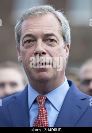 Ukip leader Nigel Farage gives an interview while canvassing in ...