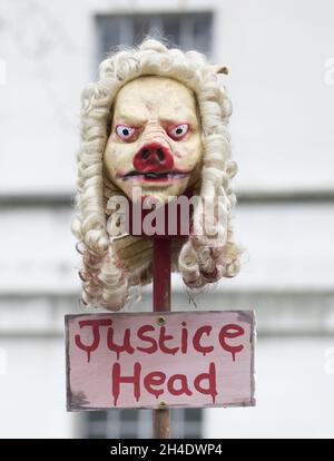 Brexit supporters hold a pigs' head as the "Justice head" during a ...