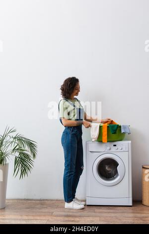 Washing denim in a washing machine Stock Photo - Alamy
