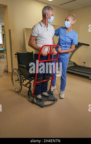 Occupational therapy: male stroke patient doing remedial exercises ...