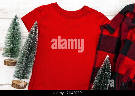 Red t-shirt mock up with Christmas decoration on bright wooden ...