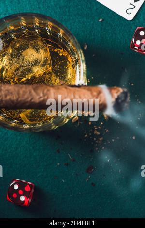 Cuban cigar and money on green background Stock Photo - Alamy