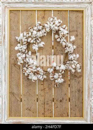 Dry cotton flowers branch, beige linen napkin top view on beige ...