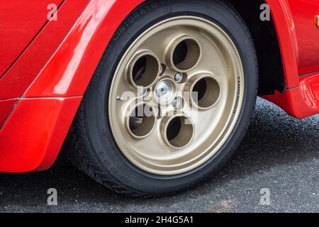 Close up detail of a gold Campagnolo Bravo alloy wheel on a red ...
