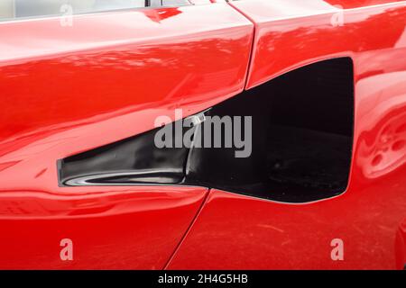 Close up detail of the NACA duct air scoop on the left side of a red ...