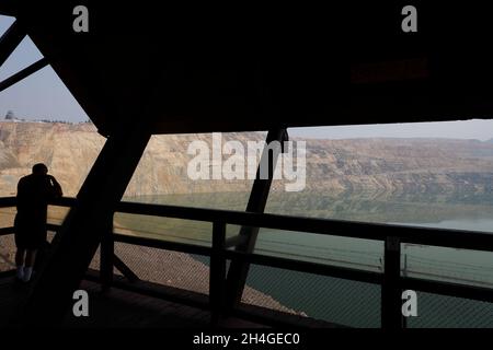 Visitors at viewing platform looking at Berkeley Pit, an open pit ...