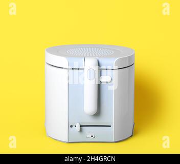 Modern deep fryer on color background Stock Photo - Alamy