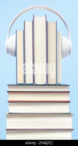 audio book concept, with stack of books, vintage headphones and an open ...