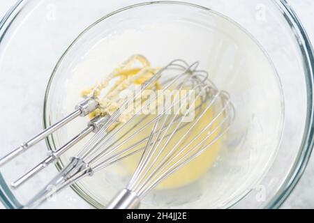 Dirty whisks in a glass mixing bowl after baking a cake Stock Photo - Alamy
