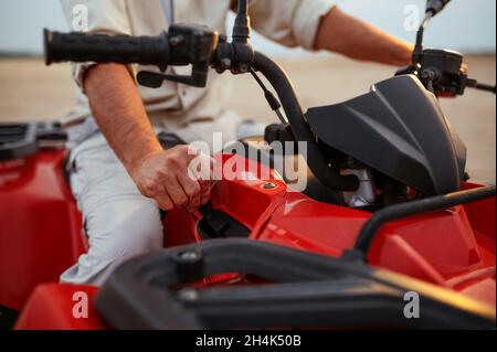 Atv racer in desert, closeup front view on hands Stock Photo - Alamy