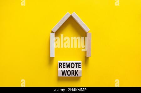 Remote work symbol. Concept words 'Remote work' on wooden blocks near ...