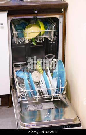 POZNAN, POLAND - Feb 28, 2016: Woman feeding young child with rice by a ...