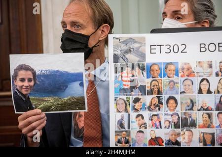 Michael Stumo, left, holds a photo of his daughter Samya Rose Stumo ...