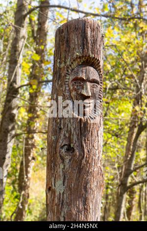 Carved masks in locust poles by Davy Arch. John Campbell Folk School ...