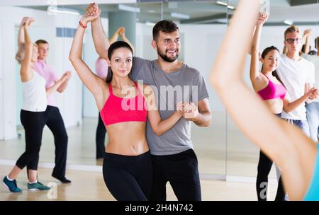Friendly dancing pair dance tango together Stock Photo - Alamy