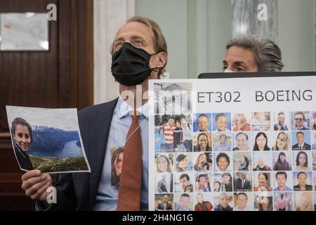Michael Stumo, left, holds a photo of his daughter Samya Rose Stumo ...