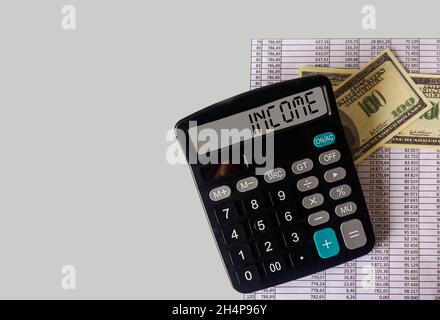 Business concept. Next to the calculator and dollars are cubes with the ...