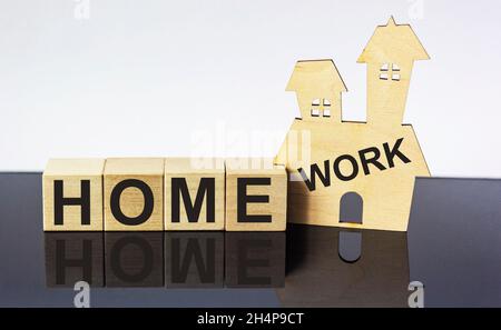Wooden cubes with the word home, home on a black background. Real ...