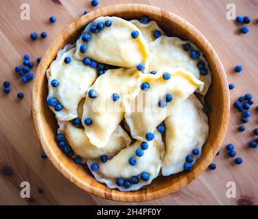 Traditional ukrainian dish vareniki served in a bowl with sour cream ...