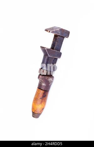 Vintage antique rusty plumber monkey wrench with a wooden handle ...
