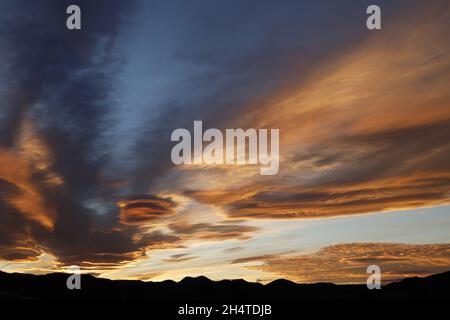 Dramatic sunset above the mountains and explosion of colors Stock Photo ...