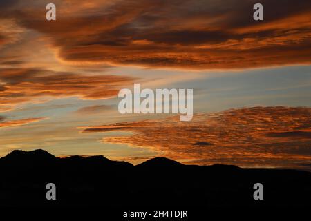 Dramatic sunset above the mountains and explosion of colors Stock Photo ...