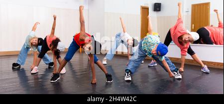 Kids training hip hop in dance studio Stock Photo - Alamy