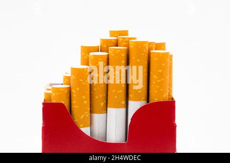 Red box full of cigarettes on isolated Stock Photo - Alamy