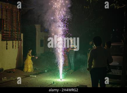 Family playing with firecrackers Stock Photo - Alamy